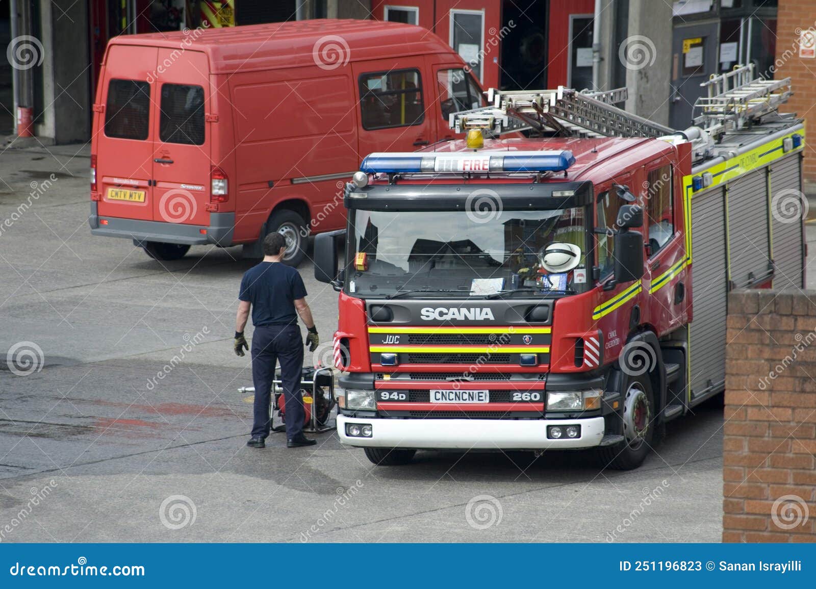 Fireman Working on a Fire Engine Editorial Stock Photo - Image of ...