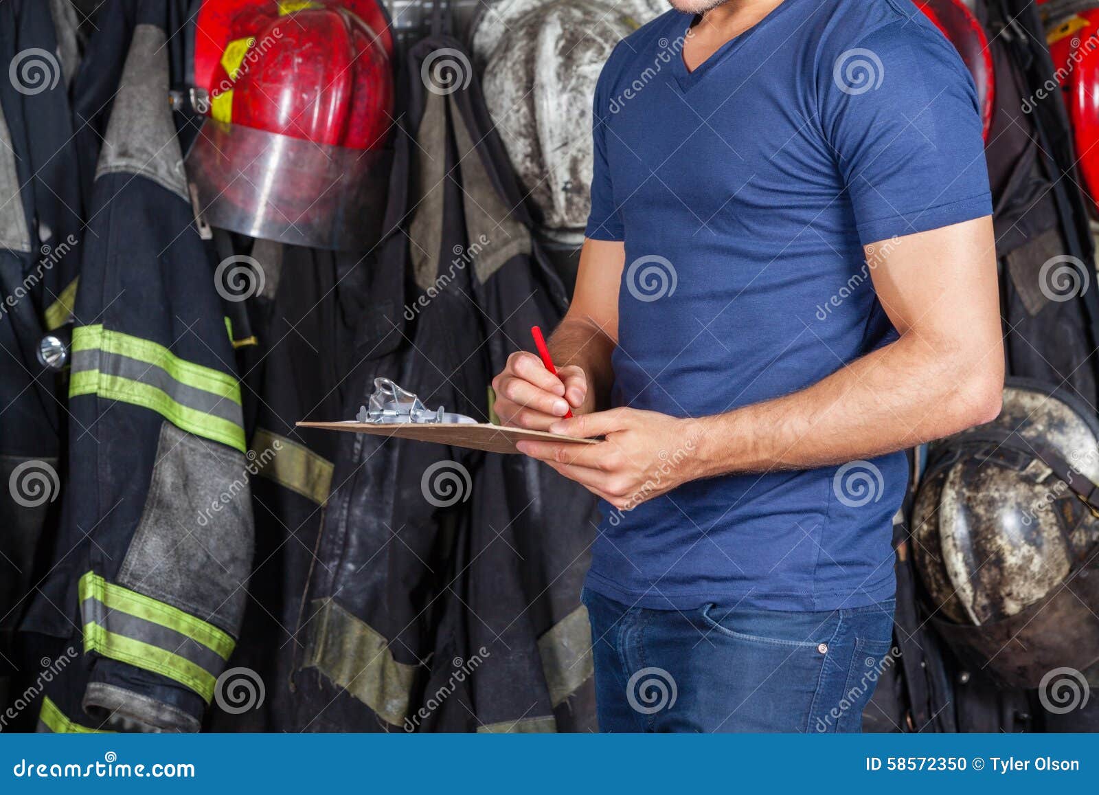 Fireman Writing on Clipboard Stock Photo - Image of firefighter ...
