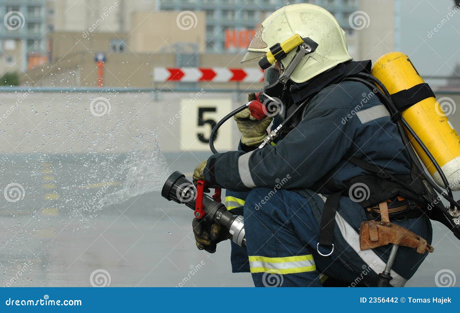 Firemen stock photo. Image of spray, fireman, yellow, helmet - 2356442