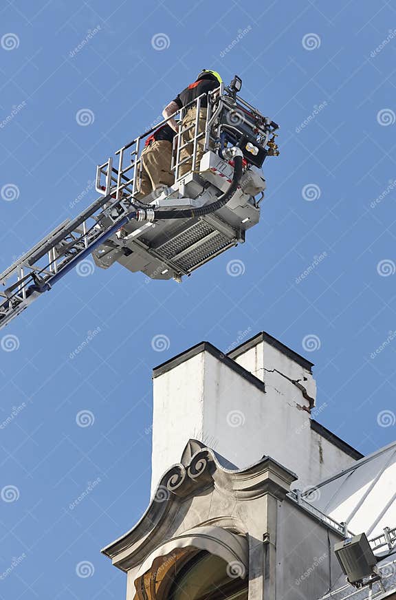 Firemen on a Crane Fixing a Structural Building Fissure Stock Image ...