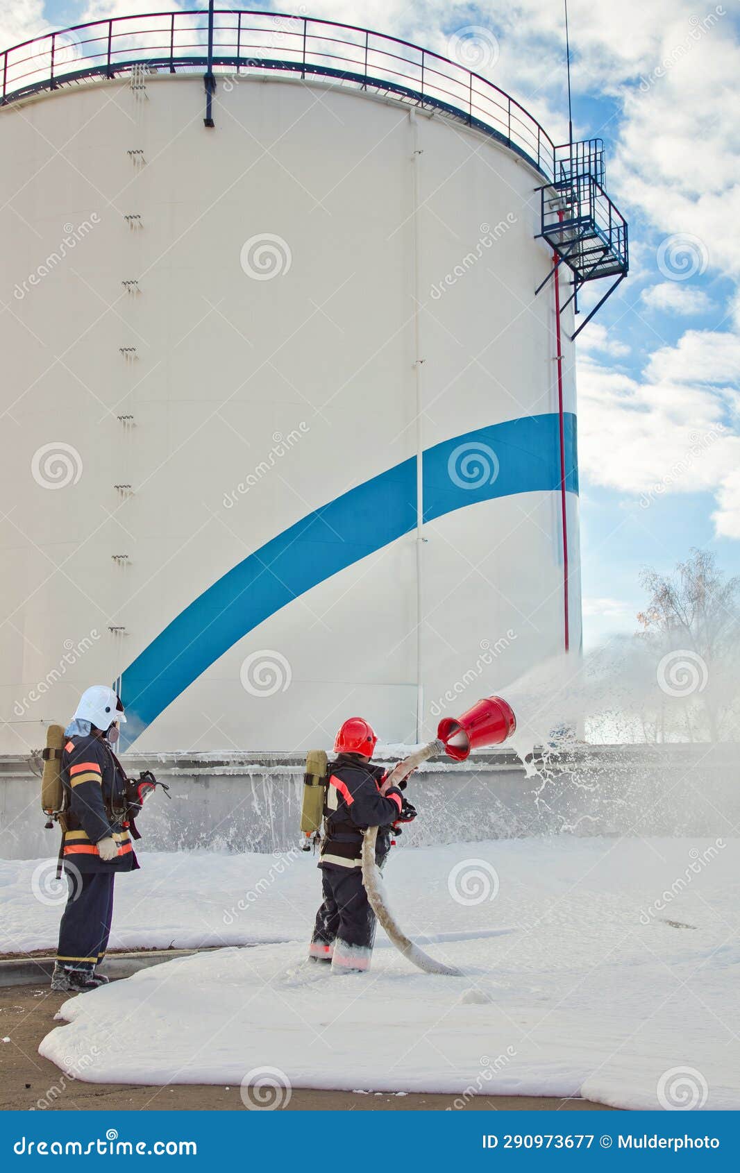 Firemen Extinguish Fire at Oil Tanks by Foam Spraying Hose Stock Image ...