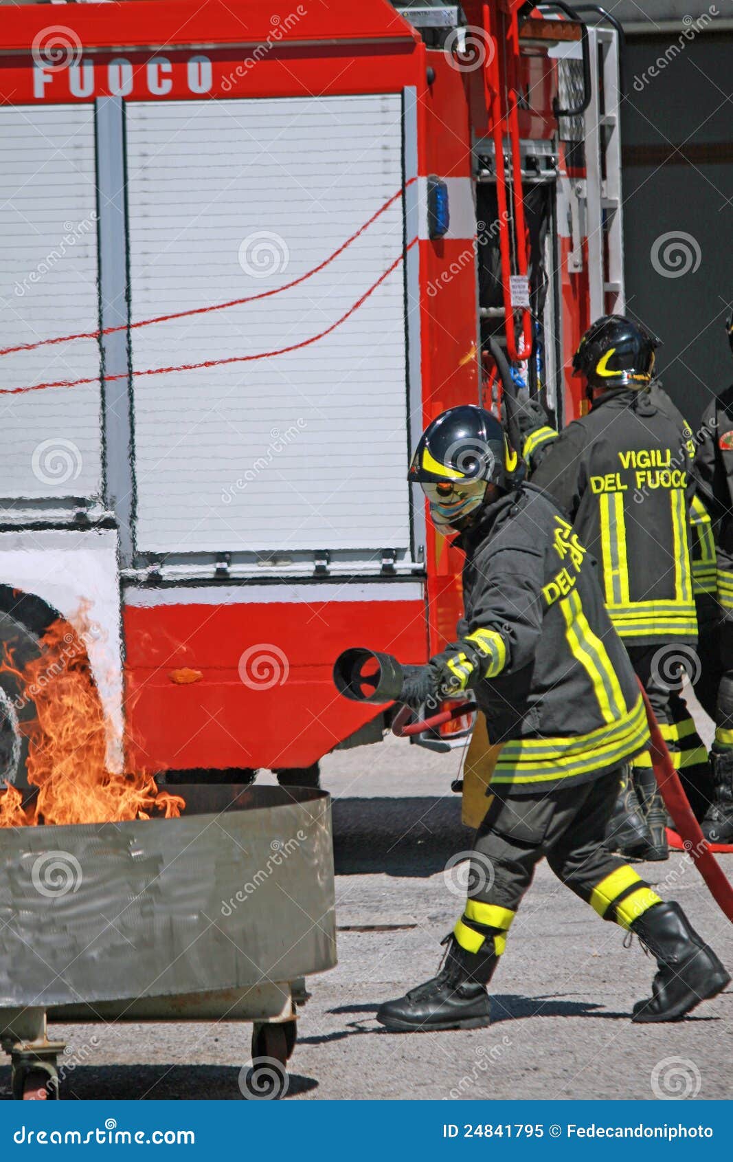 Firemen Extinguish a Simulated Fire during an Exercise in Their ...