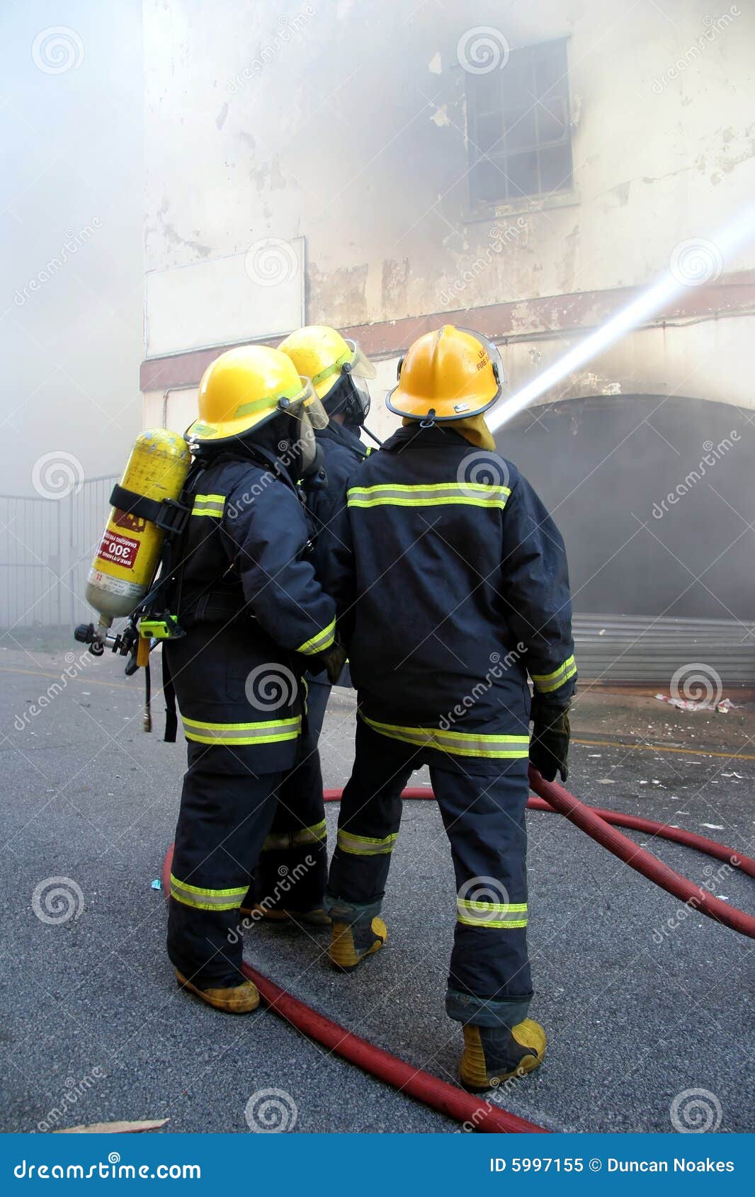 Firemen Fighting Fire stock image. Image of alarm, burn - 5997155