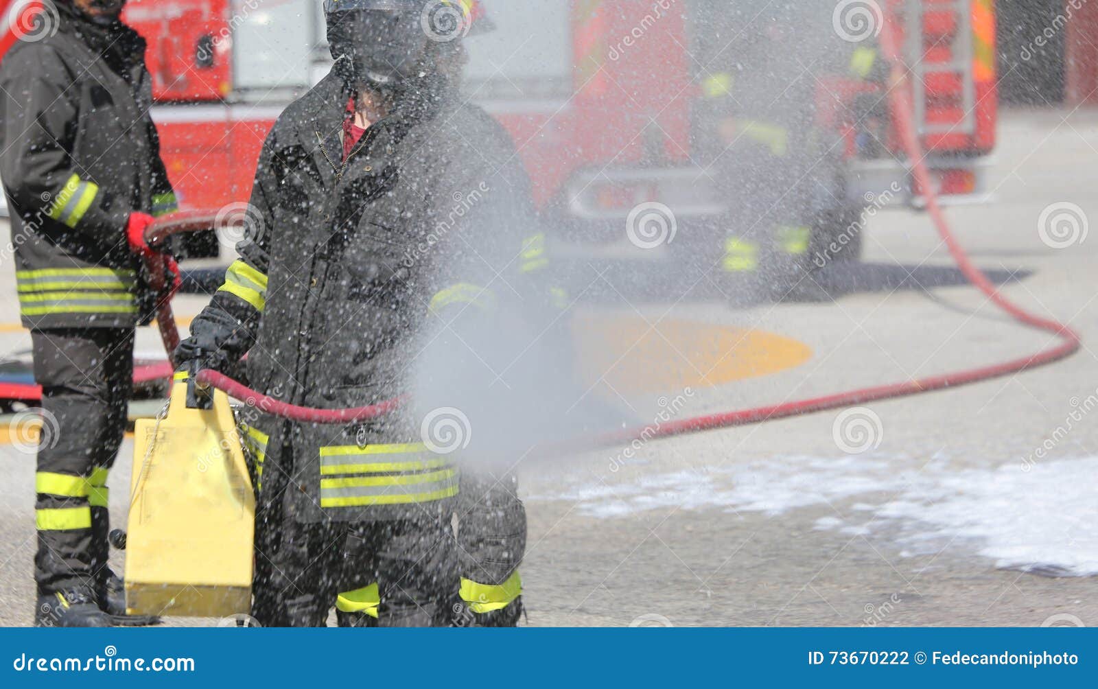 Firemen with the Fire Extinguisher during a Practice Session Stock ...