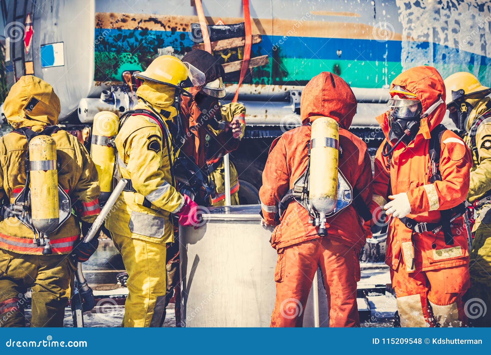 Firemen in Firefighter Uniform are Checking Their Equipment after Use ...