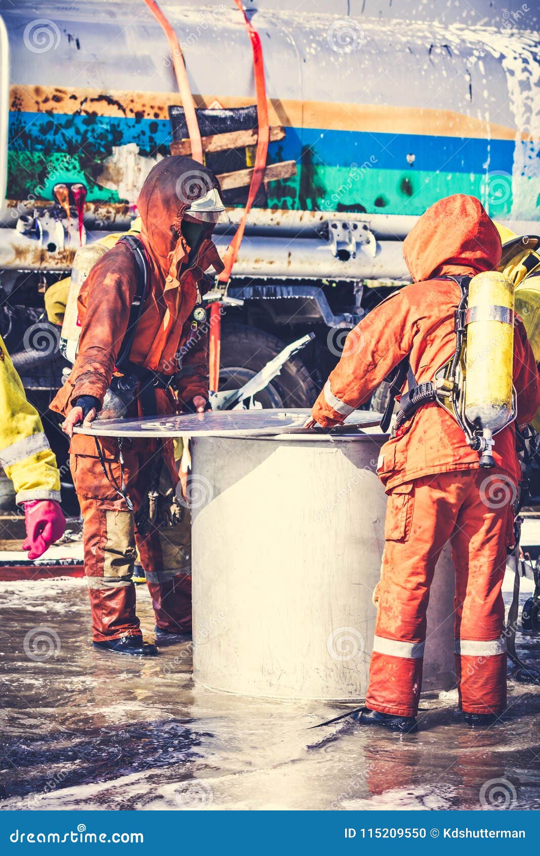 Firemen in Firefighter Uniform are Checking Their Equipment after Use ...