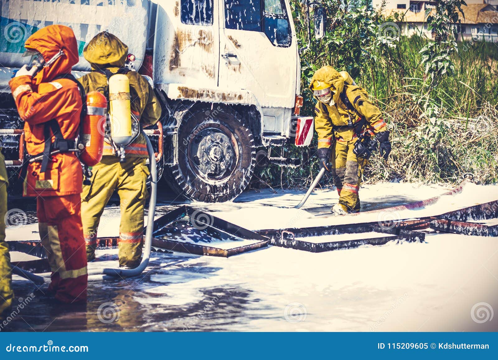 Firemen in Firefighter Uniform are Checking Their Equipment after Use ...