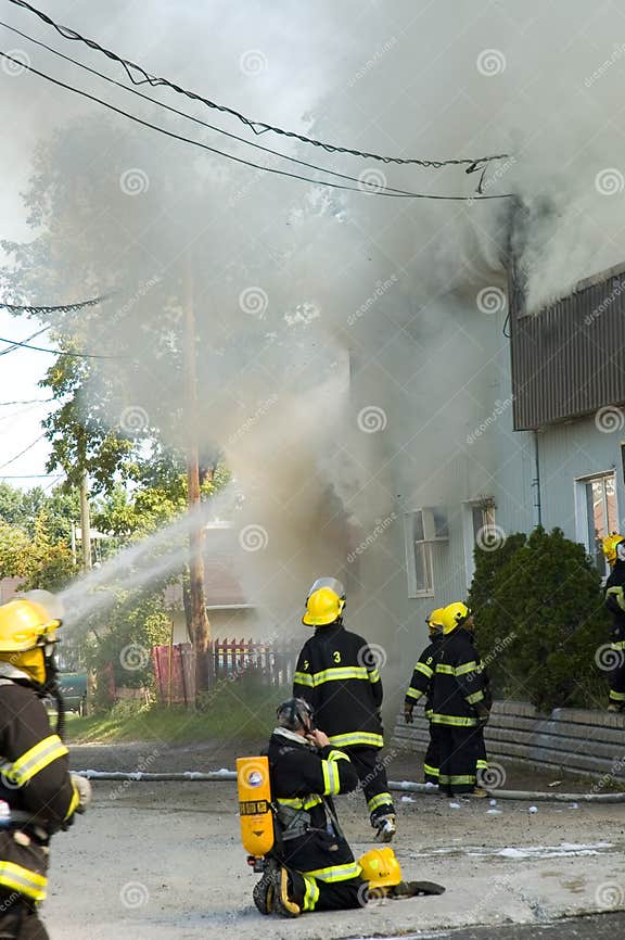 Firemen on the move stock image. Image of fight, hose - 1460377