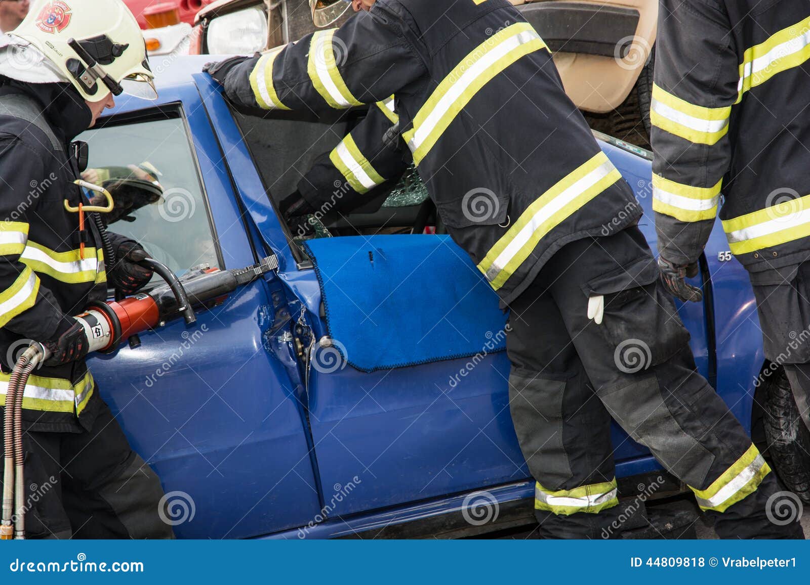 Firemen Opening the Car Doors with Hydraulic Scissors Editorial Stock ...