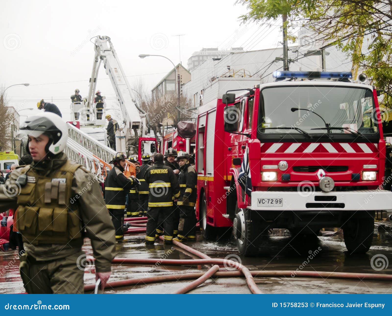 Firemen putting out a fire editorial stock photo. Image of chile - 15758253