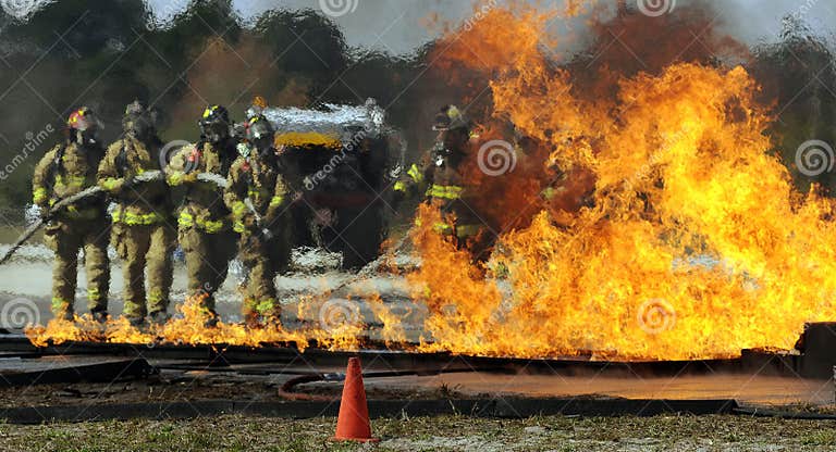 Firemen putting out fire stock photo. Image of firemen - 20716202