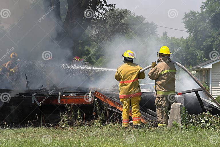 Firemen Putting Out House Fire Stock Photo - Image of outdoors, firemen ...