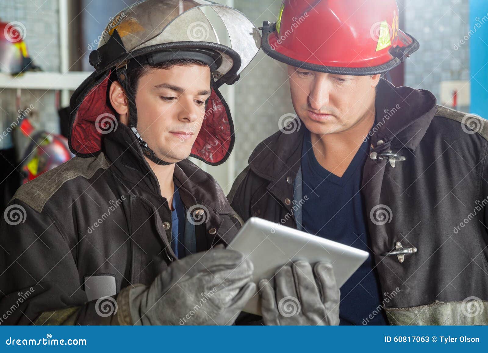 Firemen Using Digital Tablet at Fire Station Stock Image - Image of ...