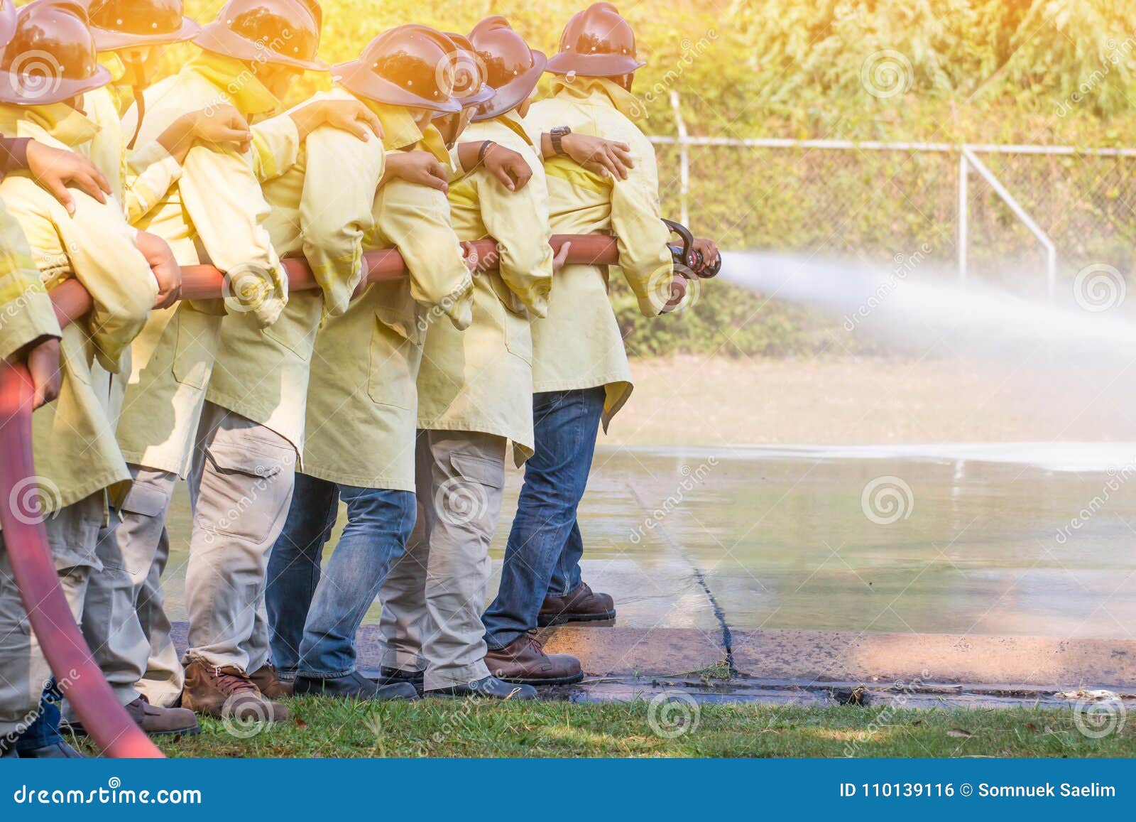 Firemen Using Extinguisher And Water From Hose For Fire Fighting ...