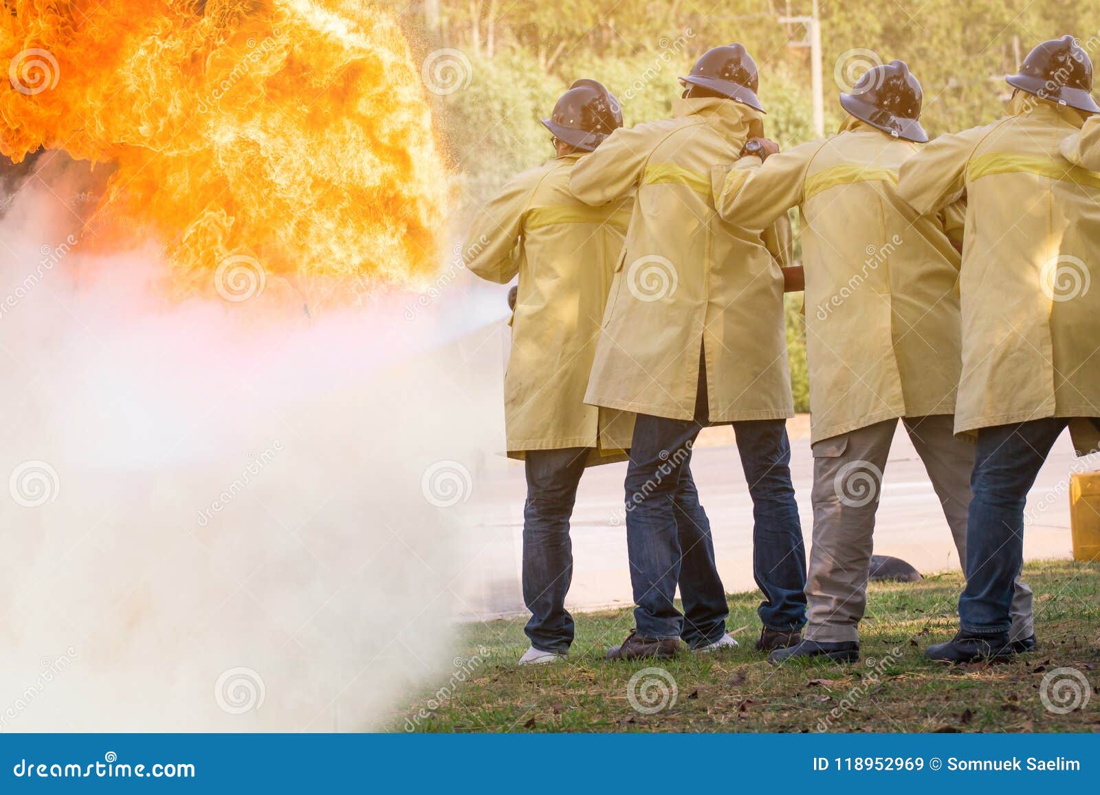 Firemen Using Water from Hose for Fire Fighting at Fire Fight Tr Stock ...