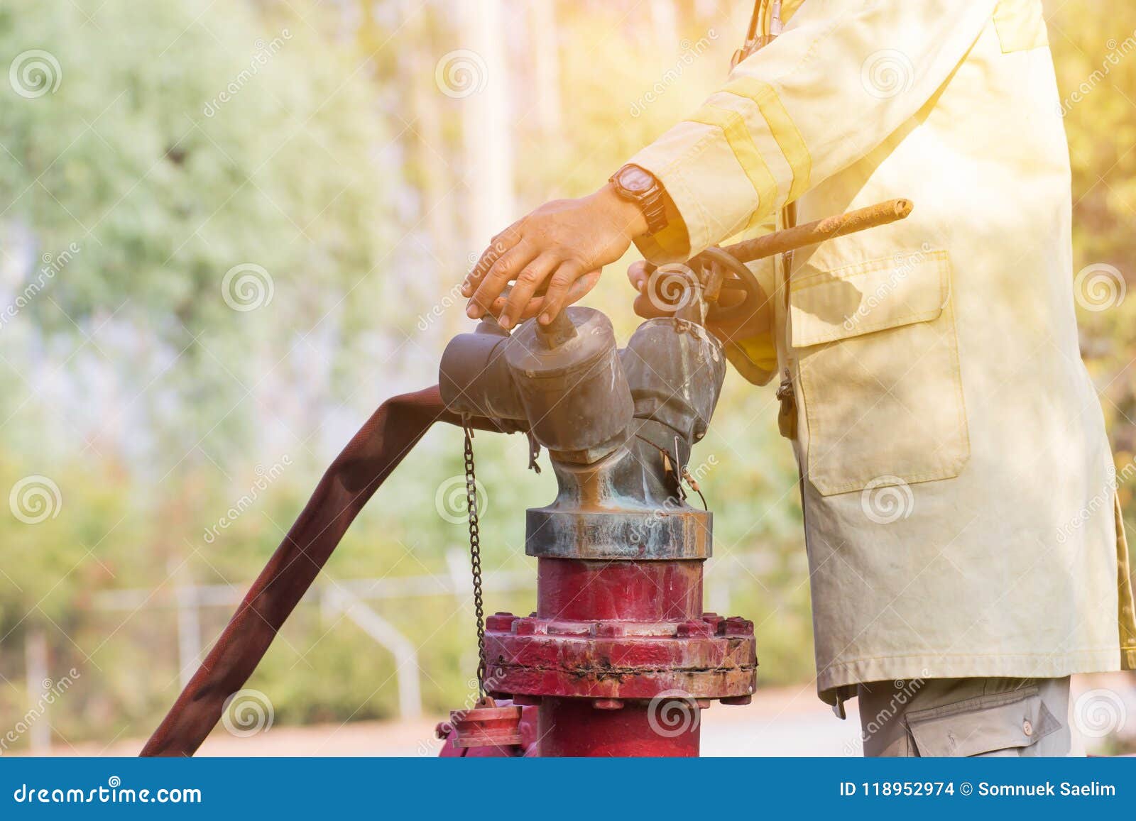 Firemen Using Water from Hose for Fire Fighting at Fire Fight Tr Stock ...