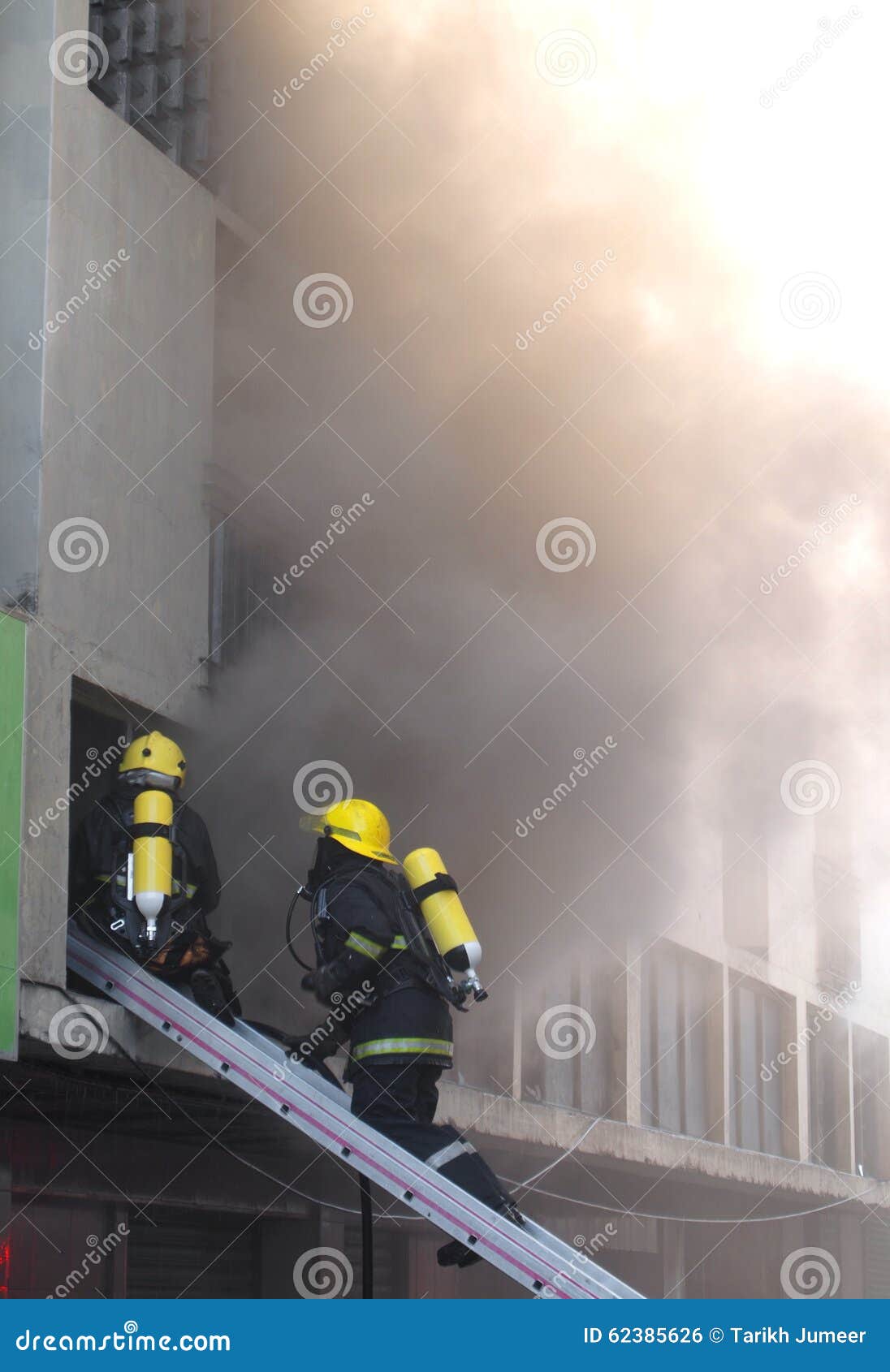 Firemen at work editorial photo. Image of burning, haze - 62385626