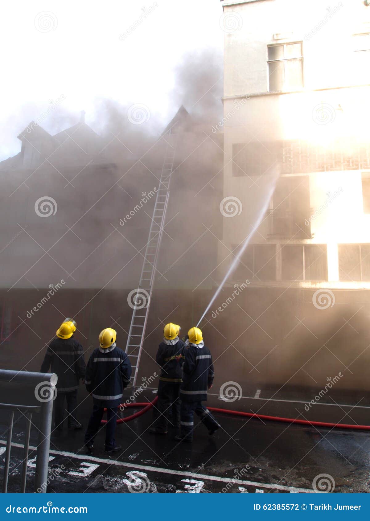 Firemen at work editorial photography. Image of road - 62385572