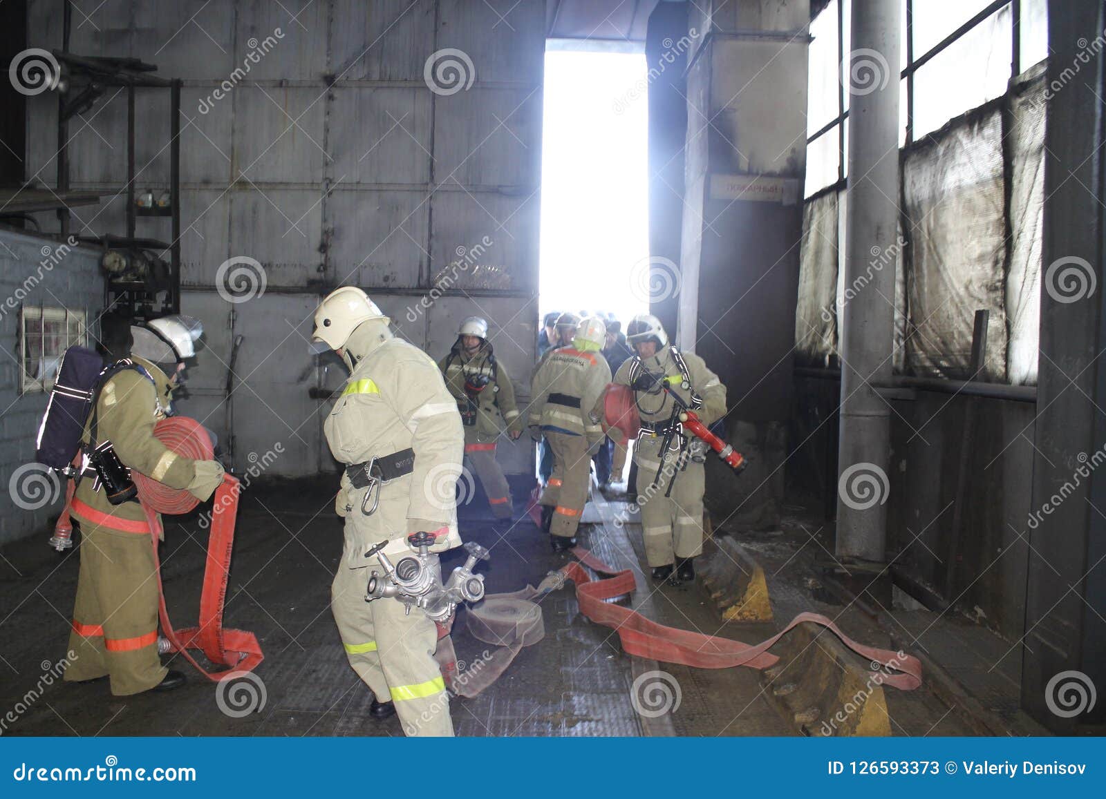 Firemen at work editorial stock photo. Image of doctrines - 126593373