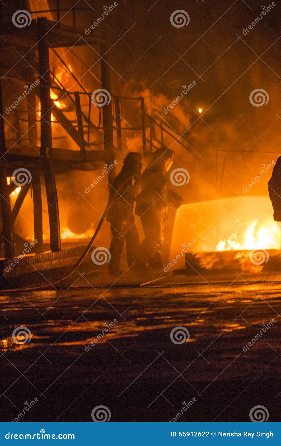 Firemen working on fire editorial photography. Image of firefighter ...