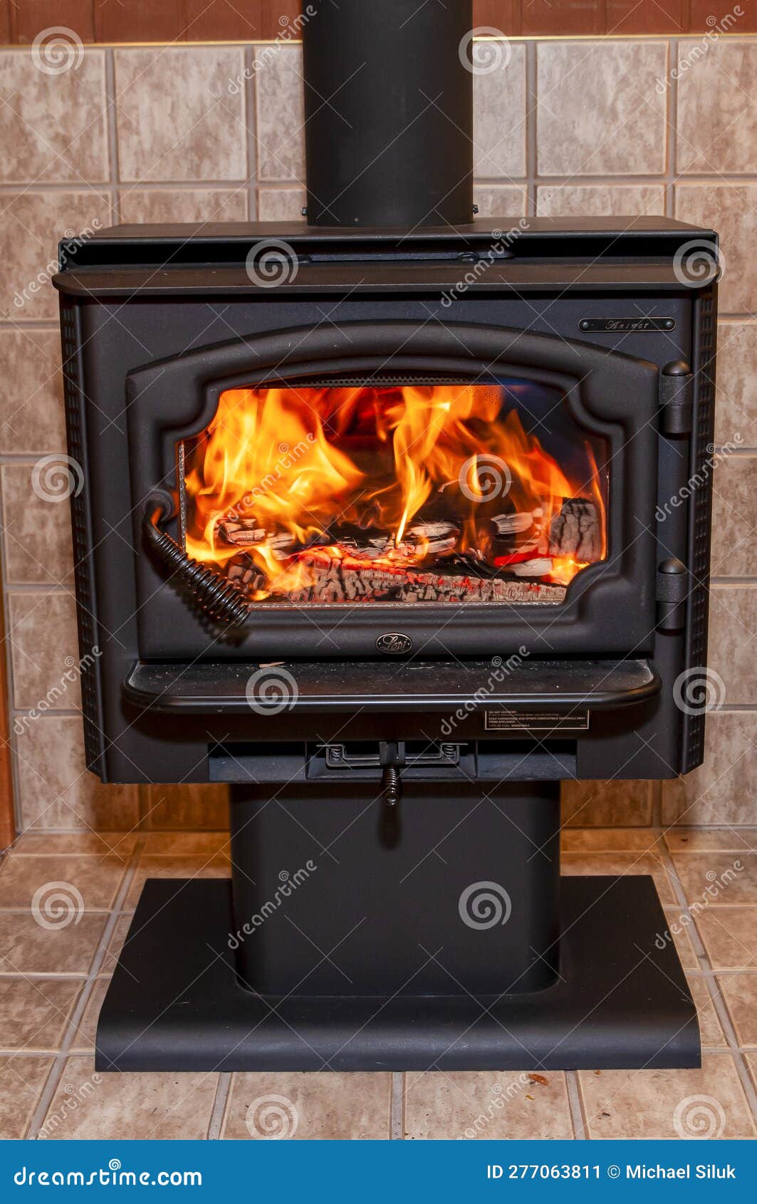 Fireplace with a Roaring Fire Inside Stock Image - Image of heater ...