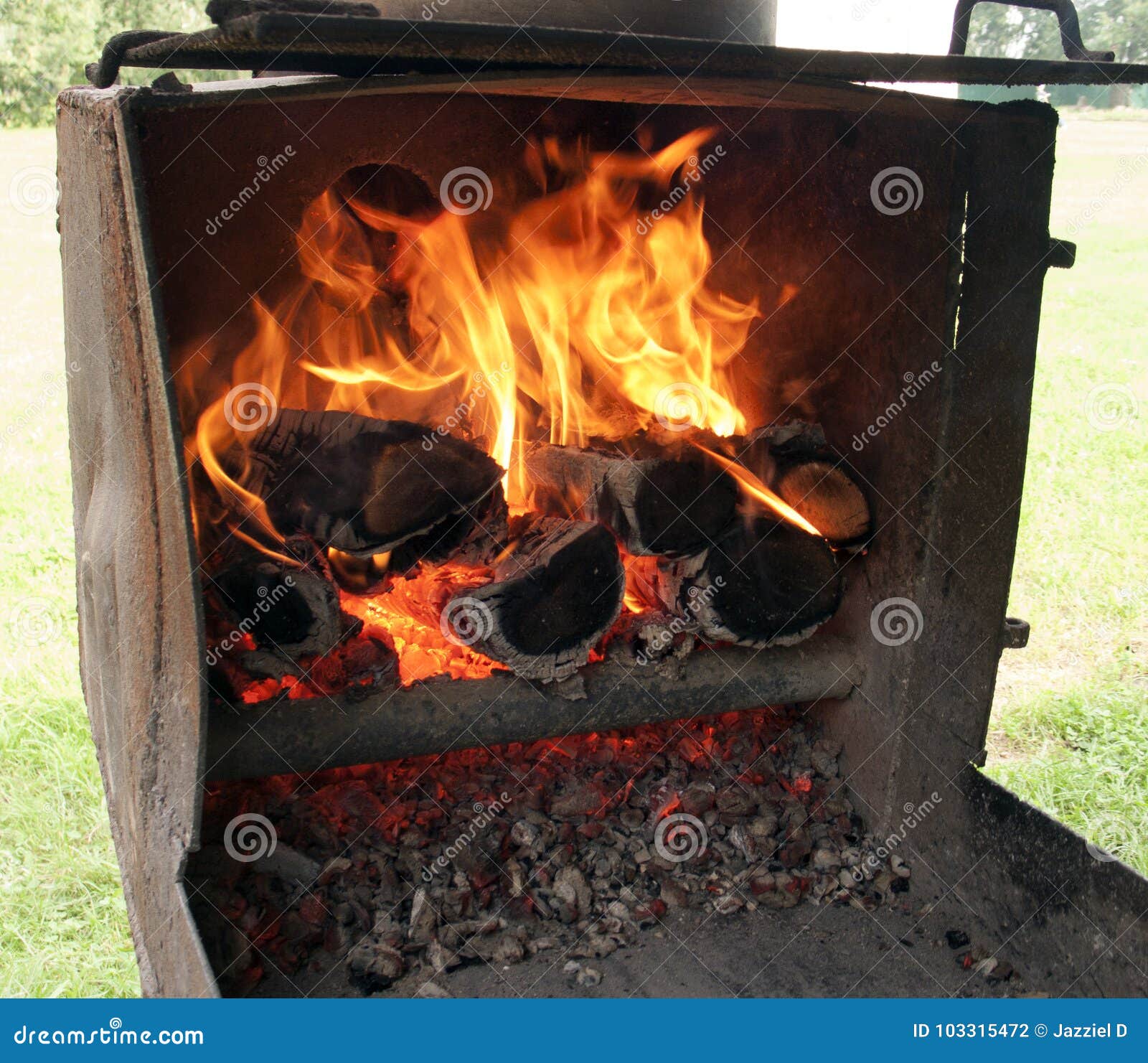 Firewood and Fire in the Old Rusty Grill Stock Photo - Image of ...