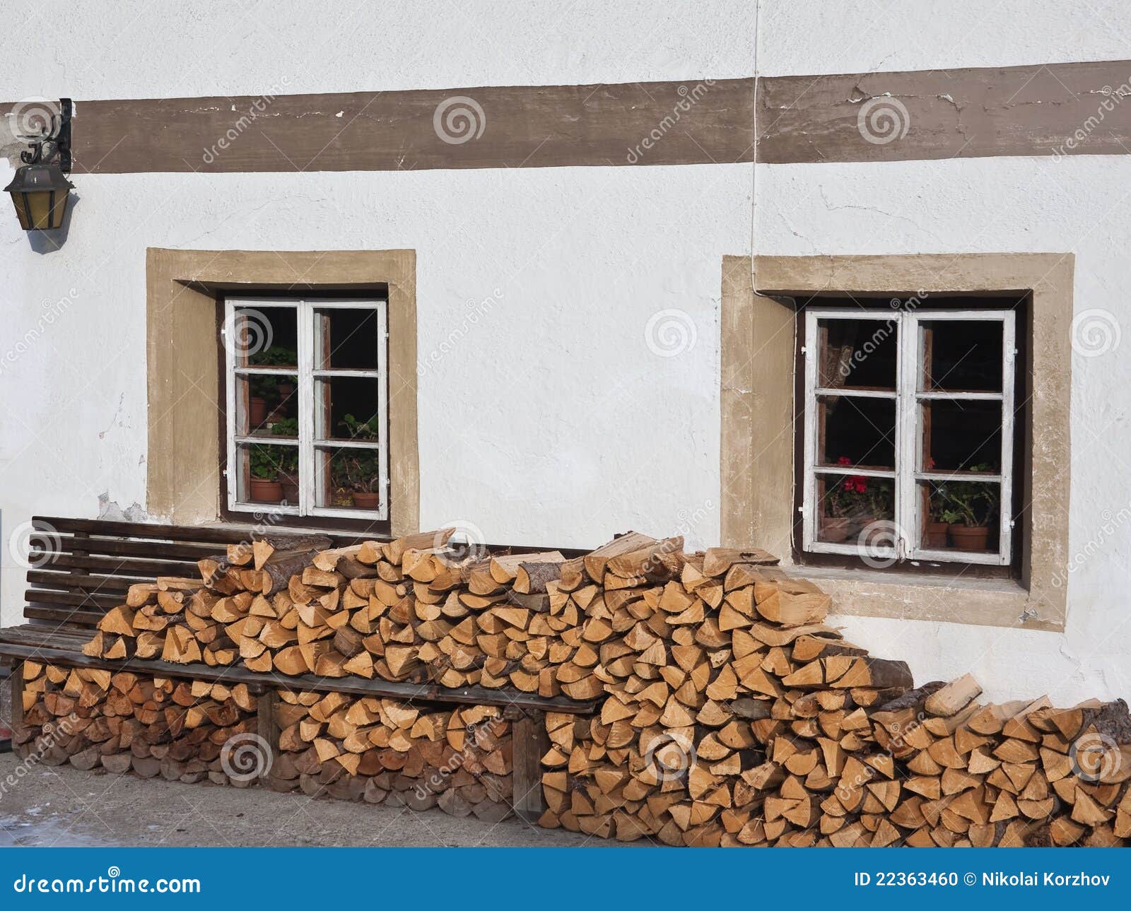 Firewood Stacked Against the Wall Stock Photo - Image of windows ...