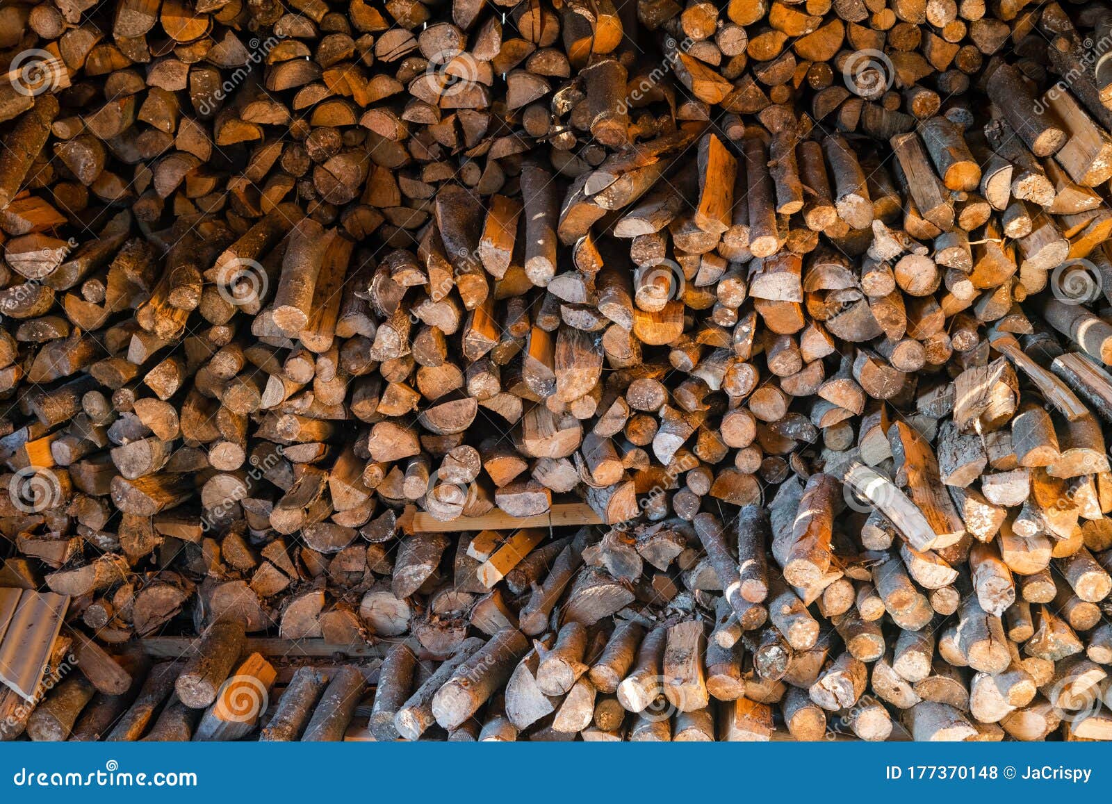 Firewood Stacked on Each Other in a Barn. Chopped Fire Wood Background ...