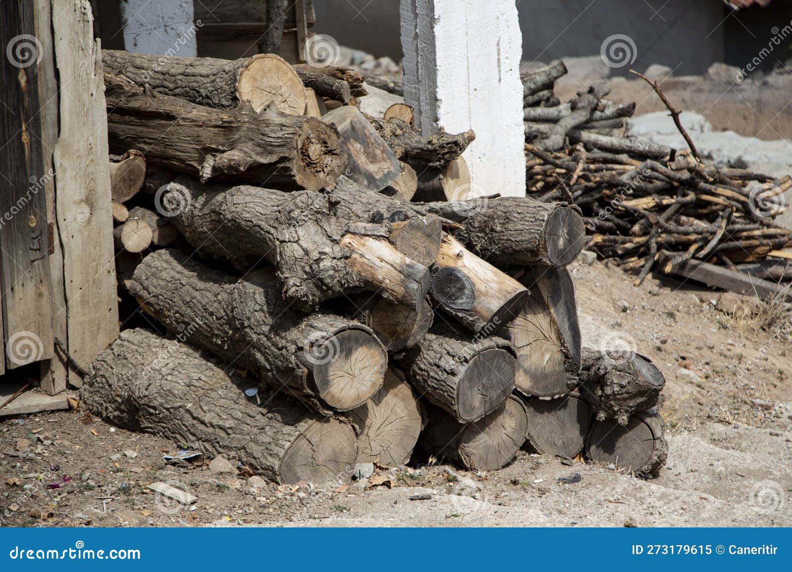 Firewood is Stacked in Front of a House in a Rural Area. Pile of ...