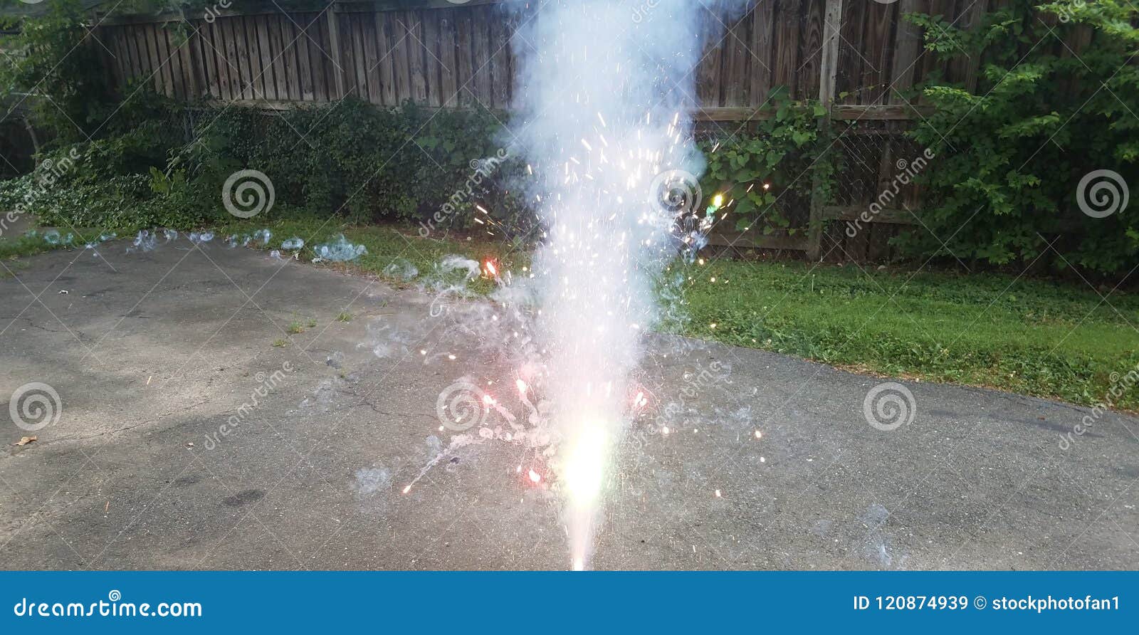 Firework or Firecracker and Sparks and Smoke in Driveway Stock Image ...