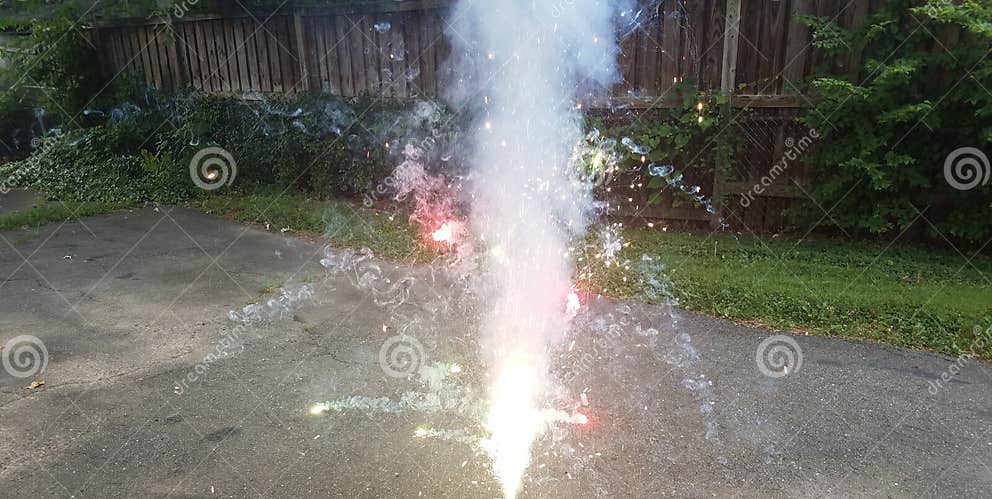 Firework or Firecracker and Sparks and Smoke in Driveway Stock Image ...