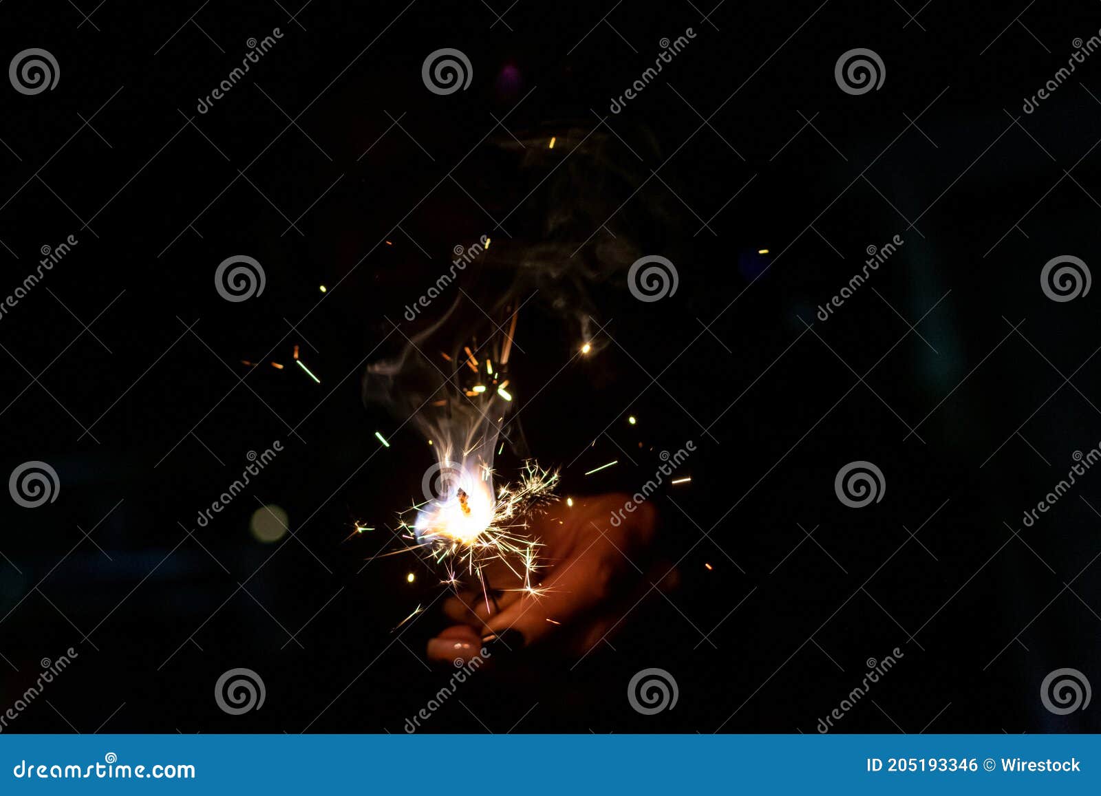 A Firework Held by One Hand. Concept of Celebrating Stock Photo - Image ...
