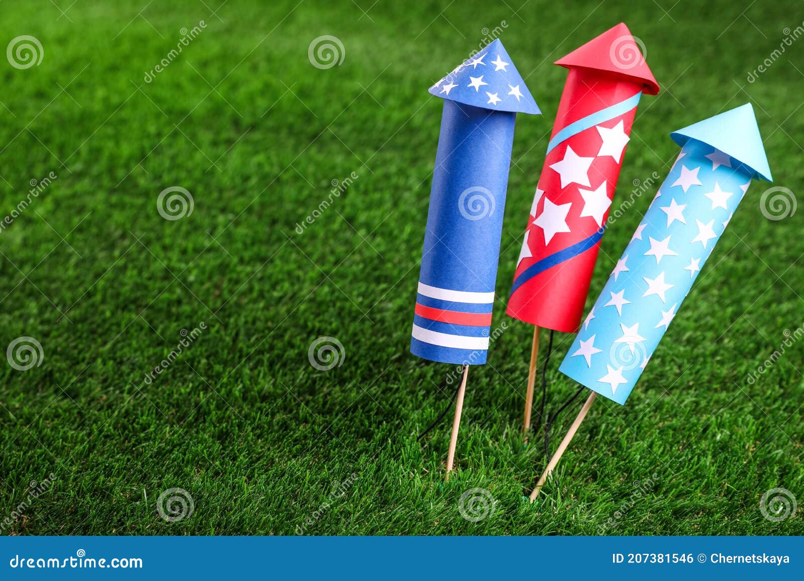 Firework Rockets on Green Grass, Closeup. Space for Text Stock Photo ...