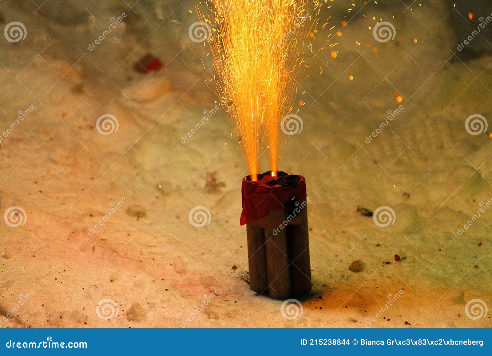 A Fireworks Burn on the Snowy Ground on New Years Eve Stock Photo ...