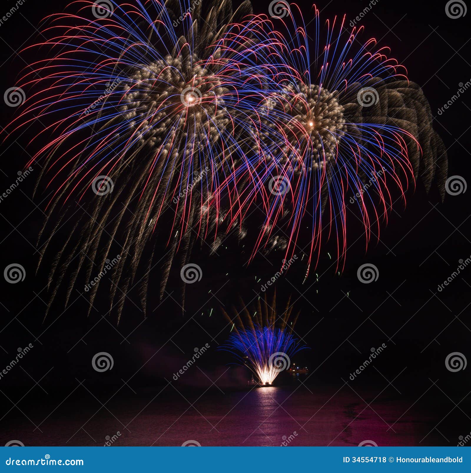 Fireworks Display Over Sea with Reflections in Water Stock Photo ...