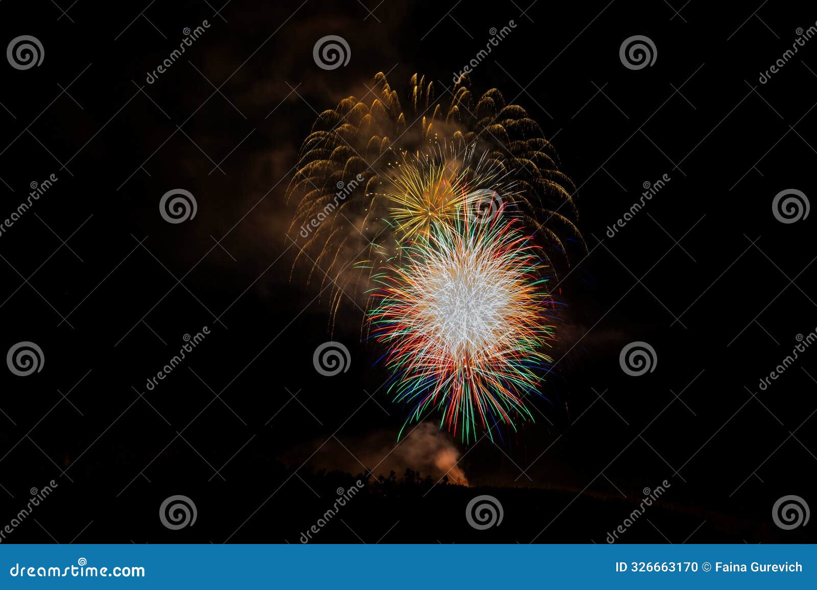 Fireworks Exploding Over the Mountains at Night in Colorado Stock Photo ...