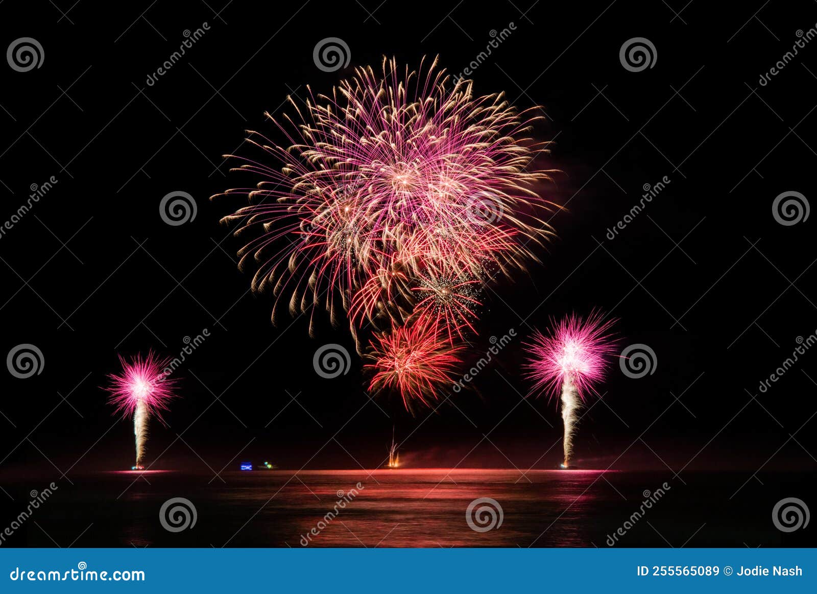Fireworks Exploding Over the Ocean at Night Stock Image - Image of ...