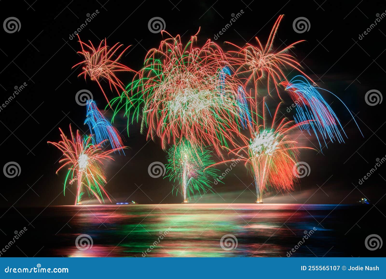 Fireworks Exploding Over the Ocean at Night Stock Image - Image of ...