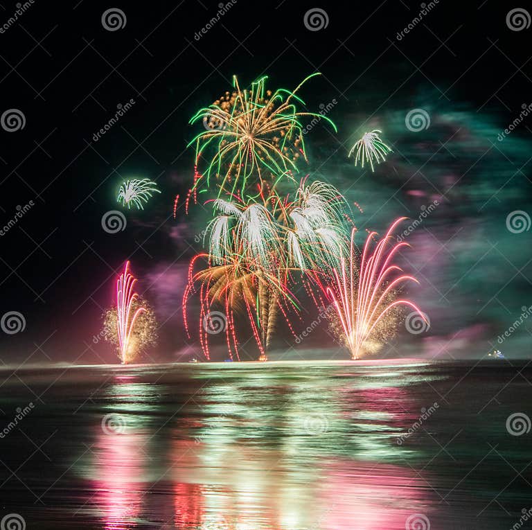Fireworks Exploding Over the Ocean at Night Stock Image - Image of ...