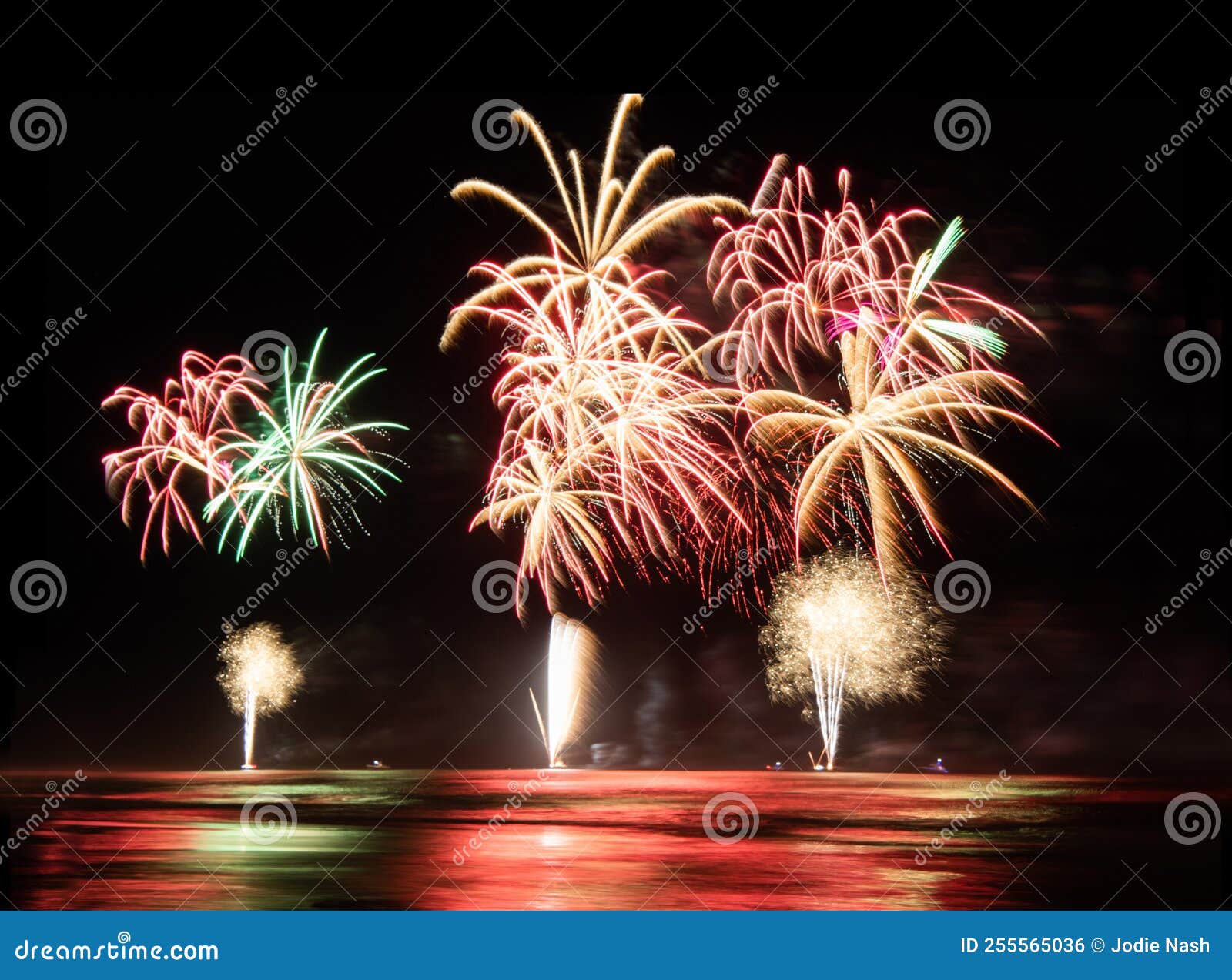 Fireworks Exploding Over the Ocean at Night Showing Coloured ...