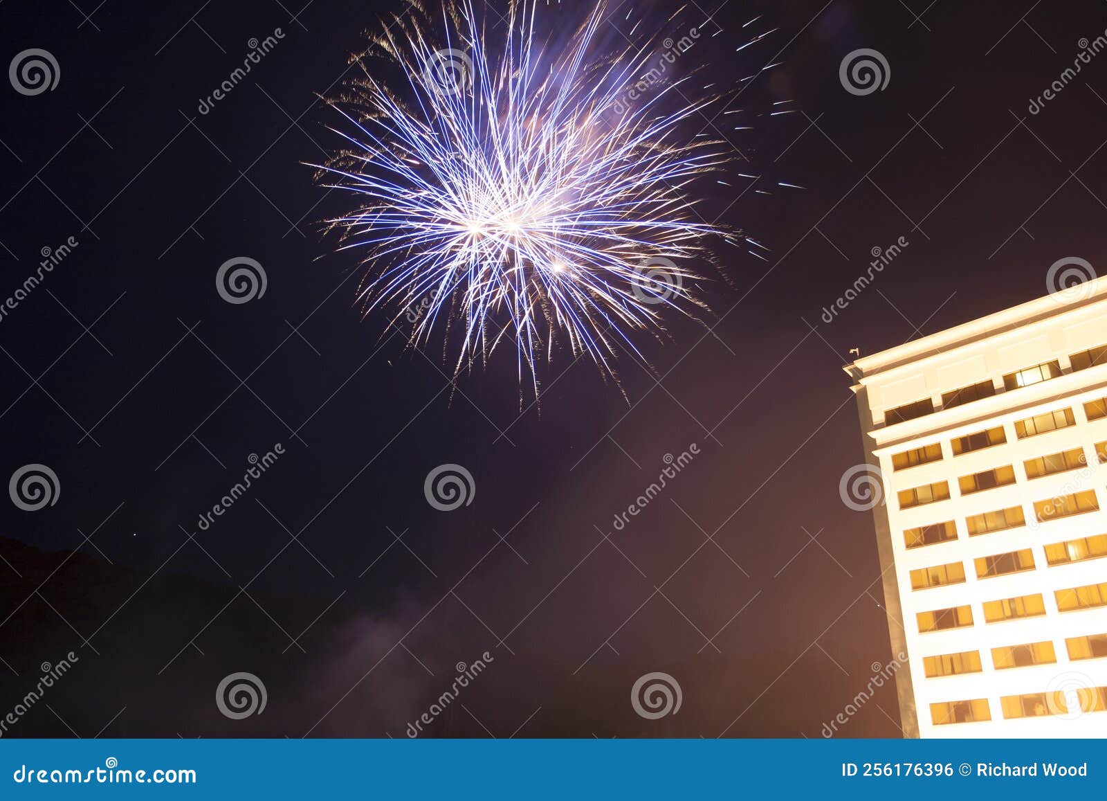 View of Fireworks Next To a Tall Building Stock Photo - Image of tall ...