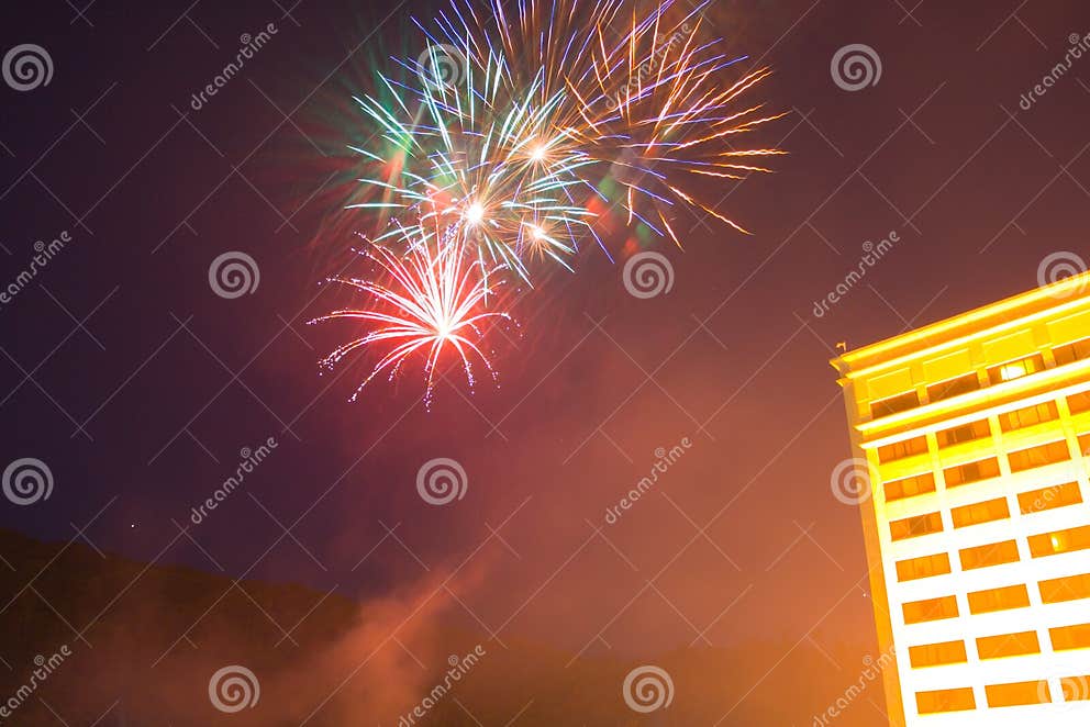 View of Fireworks Next To a Tall Building Stock Image - Image of ...