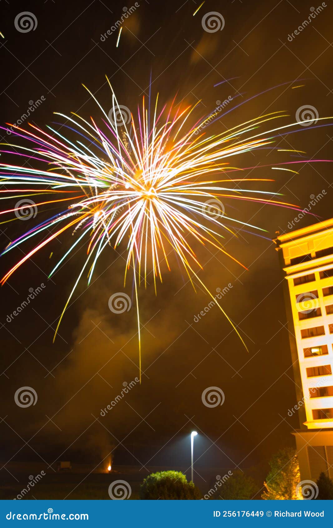 View of Fireworks Next To a Tall Building Stock Image - Image of tall ...