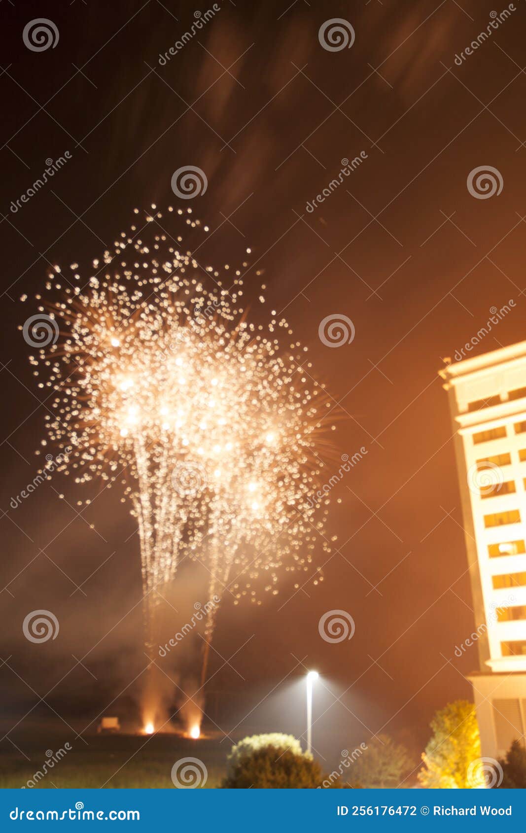 View of Fireworks Next To a Tall Building Stock Photo - Image of night ...