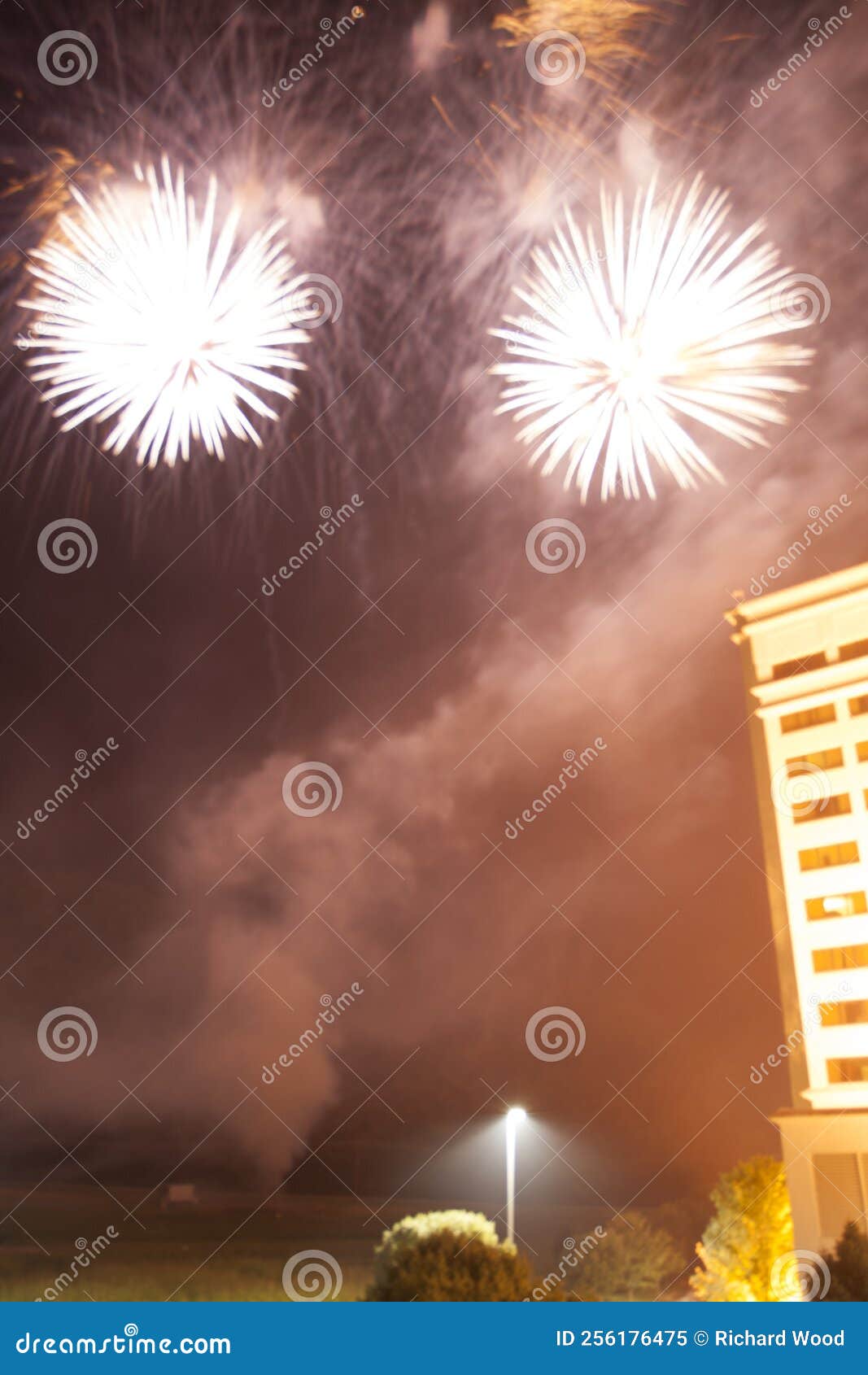 View of Fireworks Next To a Tall Building Stock Image - Image of tall ...