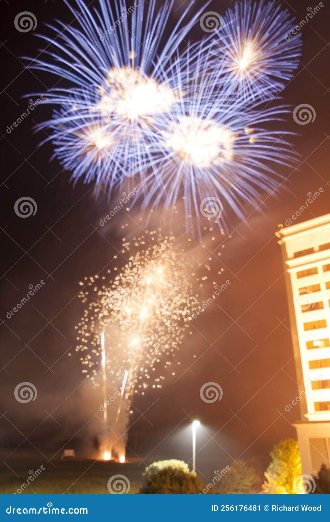 View of Fireworks Next To a Tall Building Stock Image - Image of ...