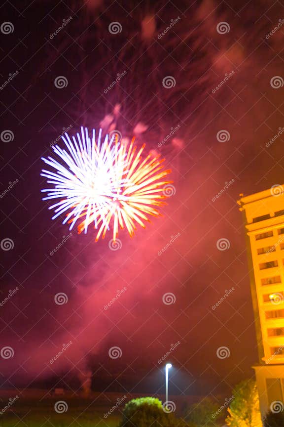 View of Fireworks Next To a Tall Building Stock Photo - Image of ...