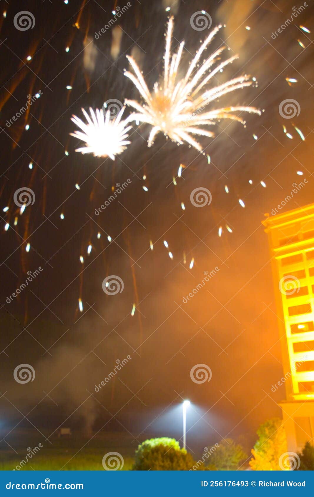View of Fireworks Next To a Tall Building Stock Image - Image of ...