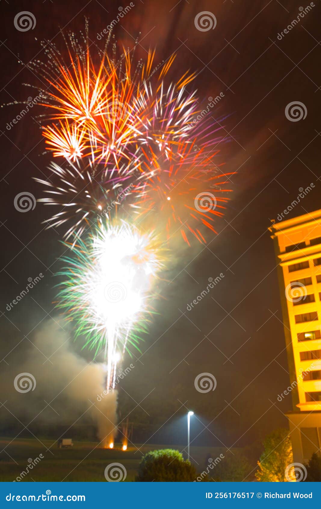 View of Fireworks Next To a Tall Building Stock Image - Image of tall ...