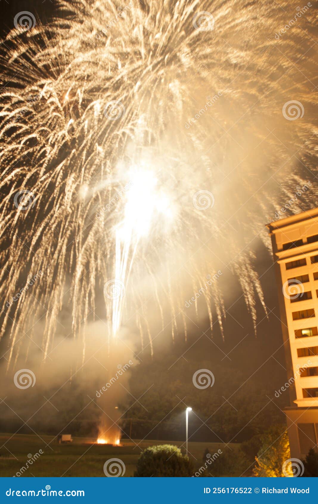 View of Fireworks Next To a Tall Building Stock Photo - Image of ...